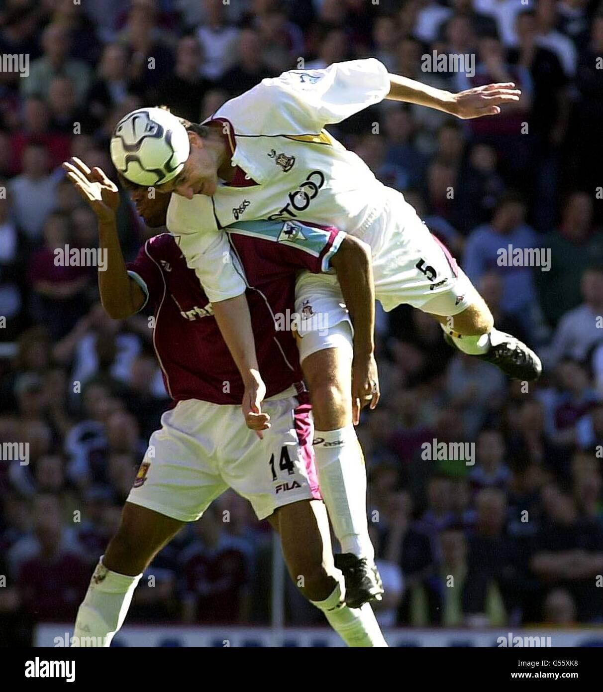 Bradford City's David Wetherall heads the ball away from West Ham's ...