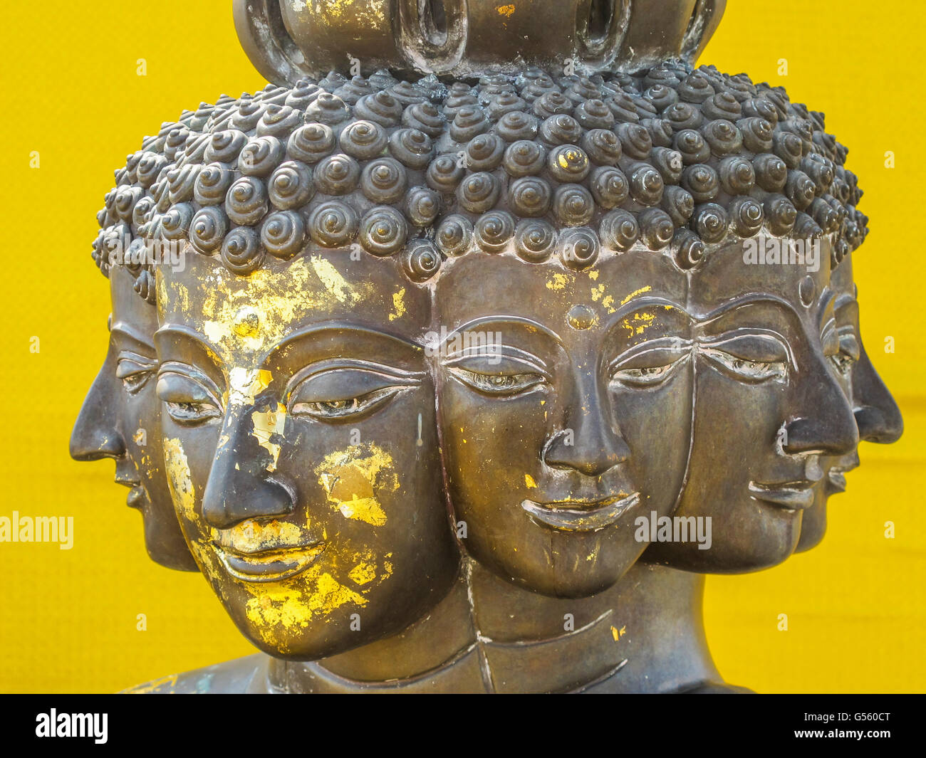 Many face statue in Bangkok Stock Photo - Alamy