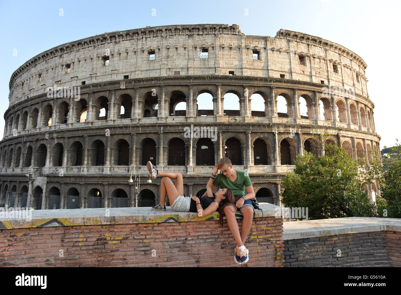 Young Couple in front of Colosseum Rome Stock Photo - Alamy