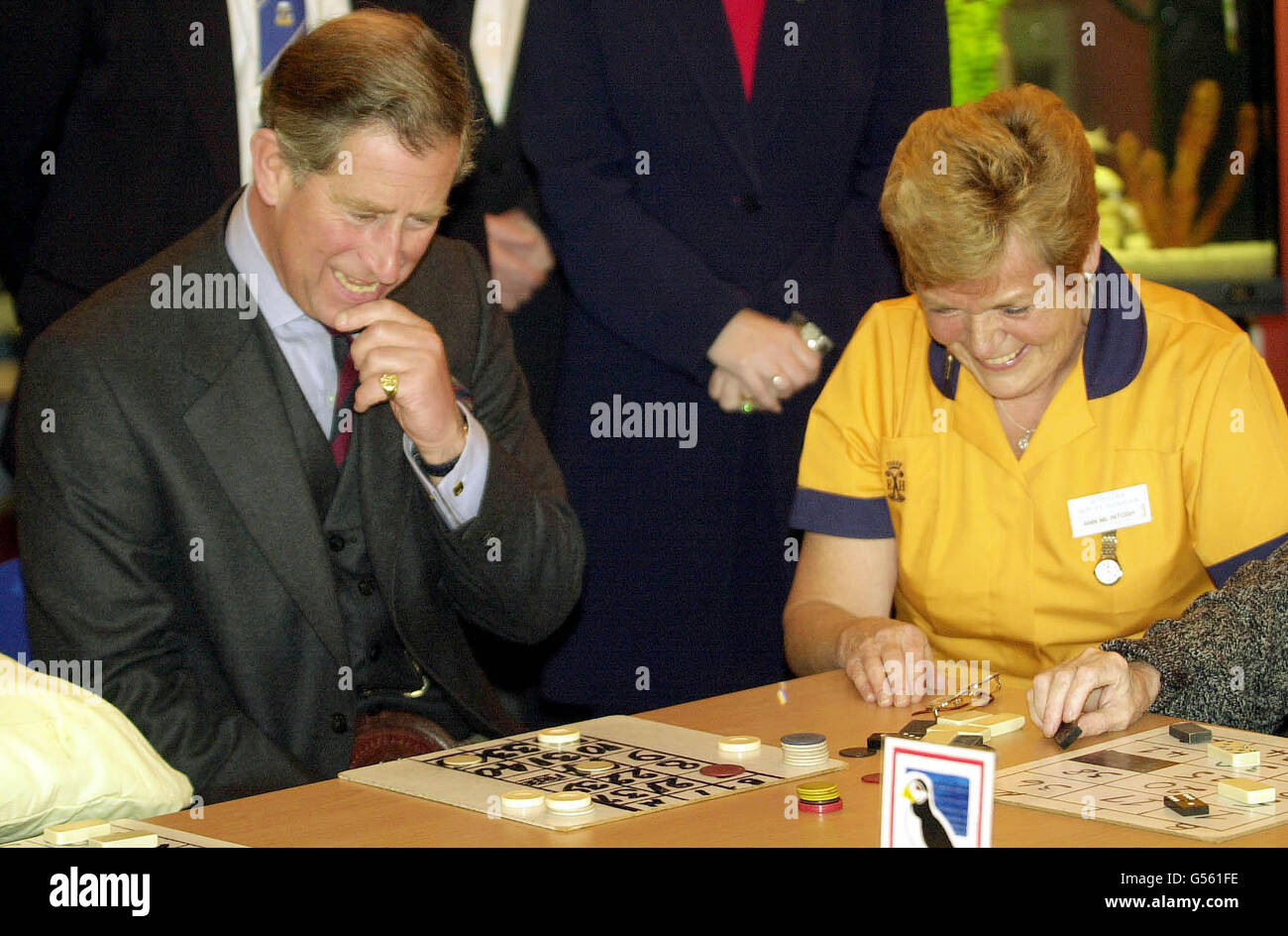 Prince Charles appears puzzled as he plays bingo with staff member Ann ...