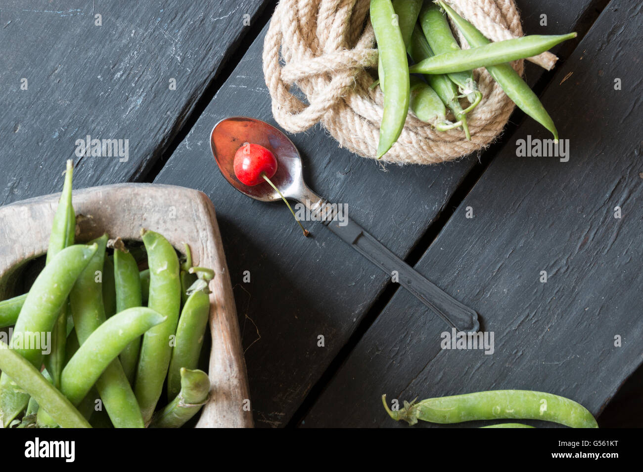 spoon with a cherry and green beans Stock Photo - Alamy