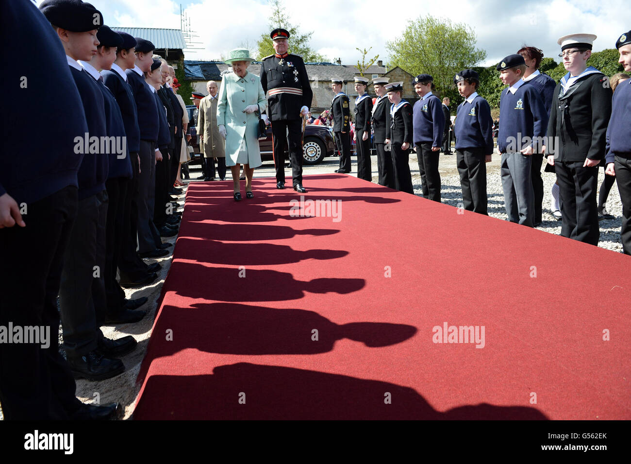 A guard of honour of Sea Cadets welcomes Queen Elizabeth II as she ...