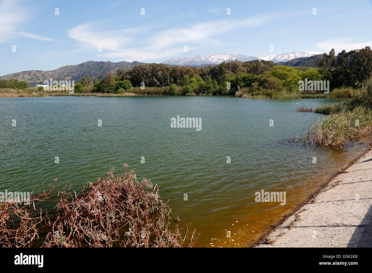 Agia reservoir, Chania, Crete, view over lake showing snow clad ...