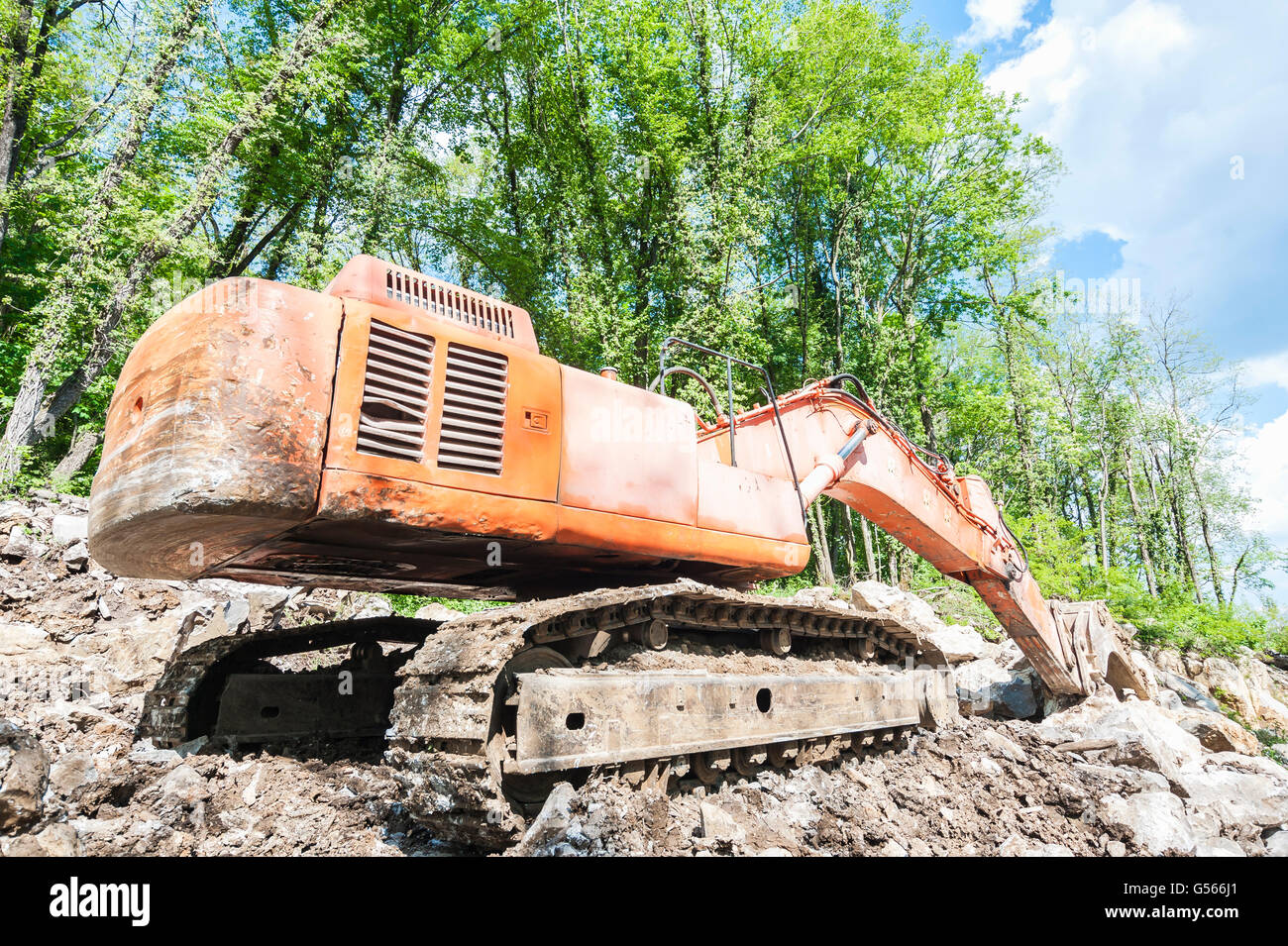 Excavator with big shovel to work with rocks Stock Photo - Alamy