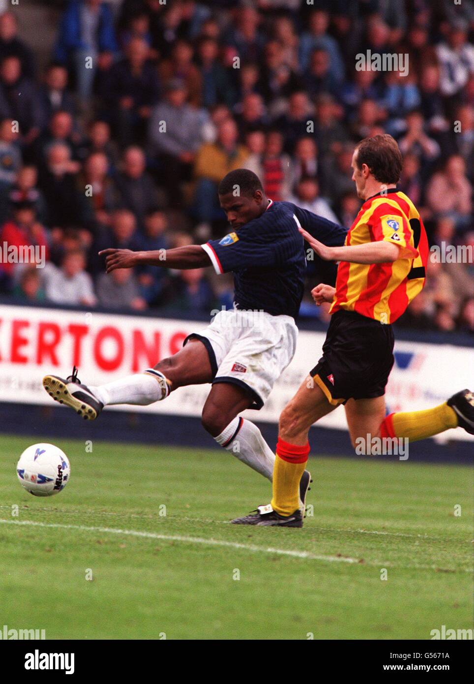 TONY ROUGIER, RAITH ROVERS, CROSSES THE BALL IN FRONT OF ALAN DINNIE ...