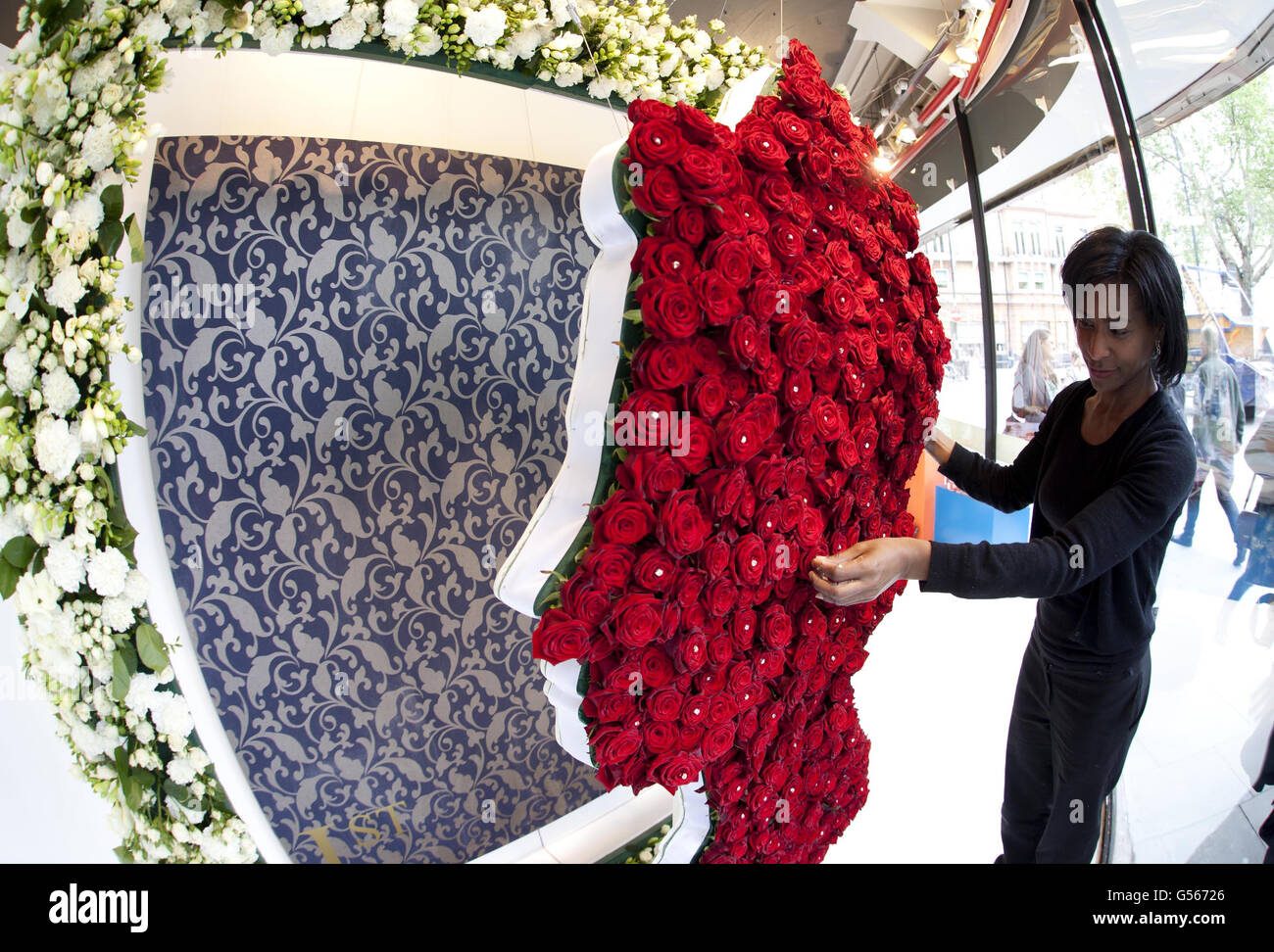 Mary McManus putting the final touches to the Peter Jones window ...