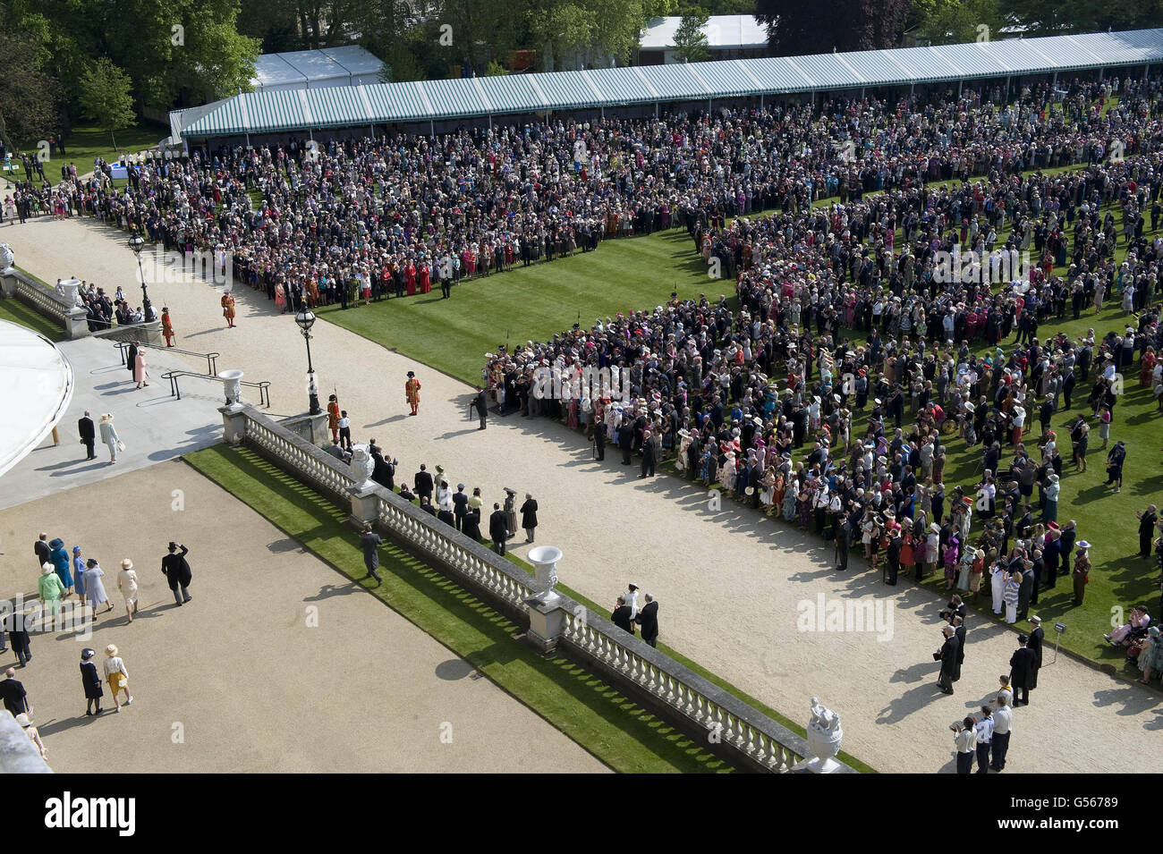Queen Elizabeth II (centre left of frame) before walking down steps to ...