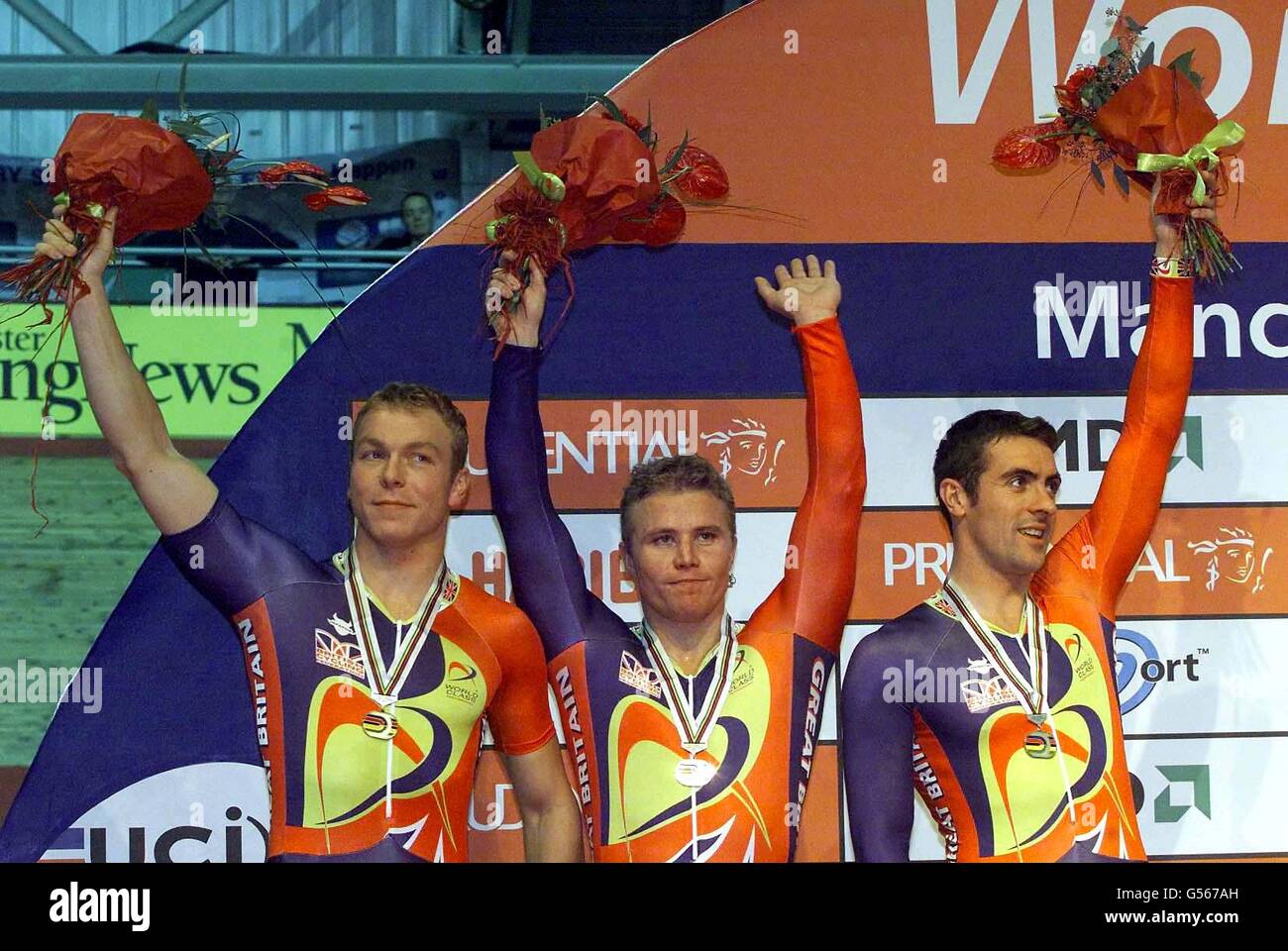 Sport cycling celebrating arms raised medals hi-res stock photography ...