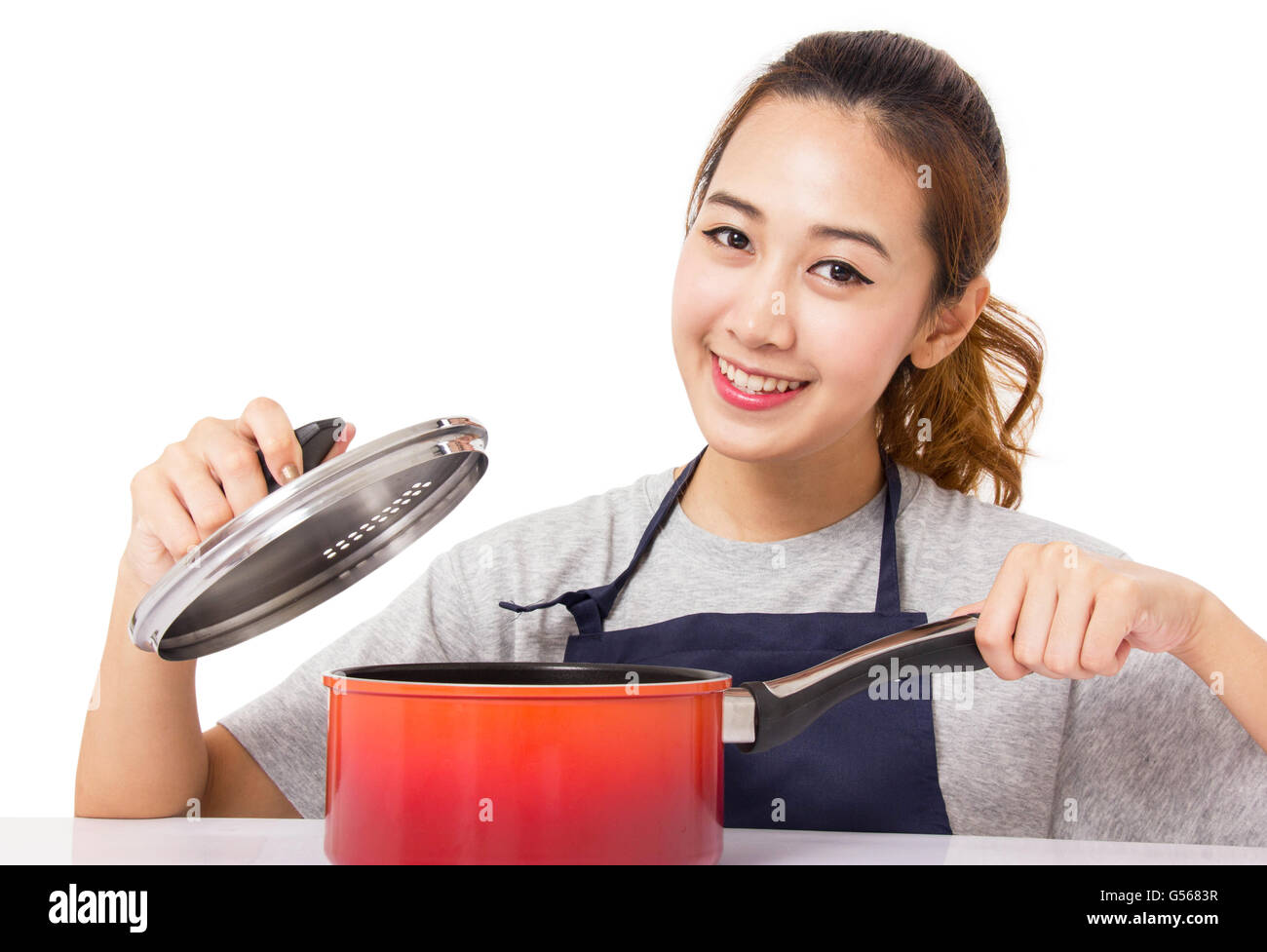 Asian Woman Cooking in the kitchen isolated on white Stock Photo - Alamy