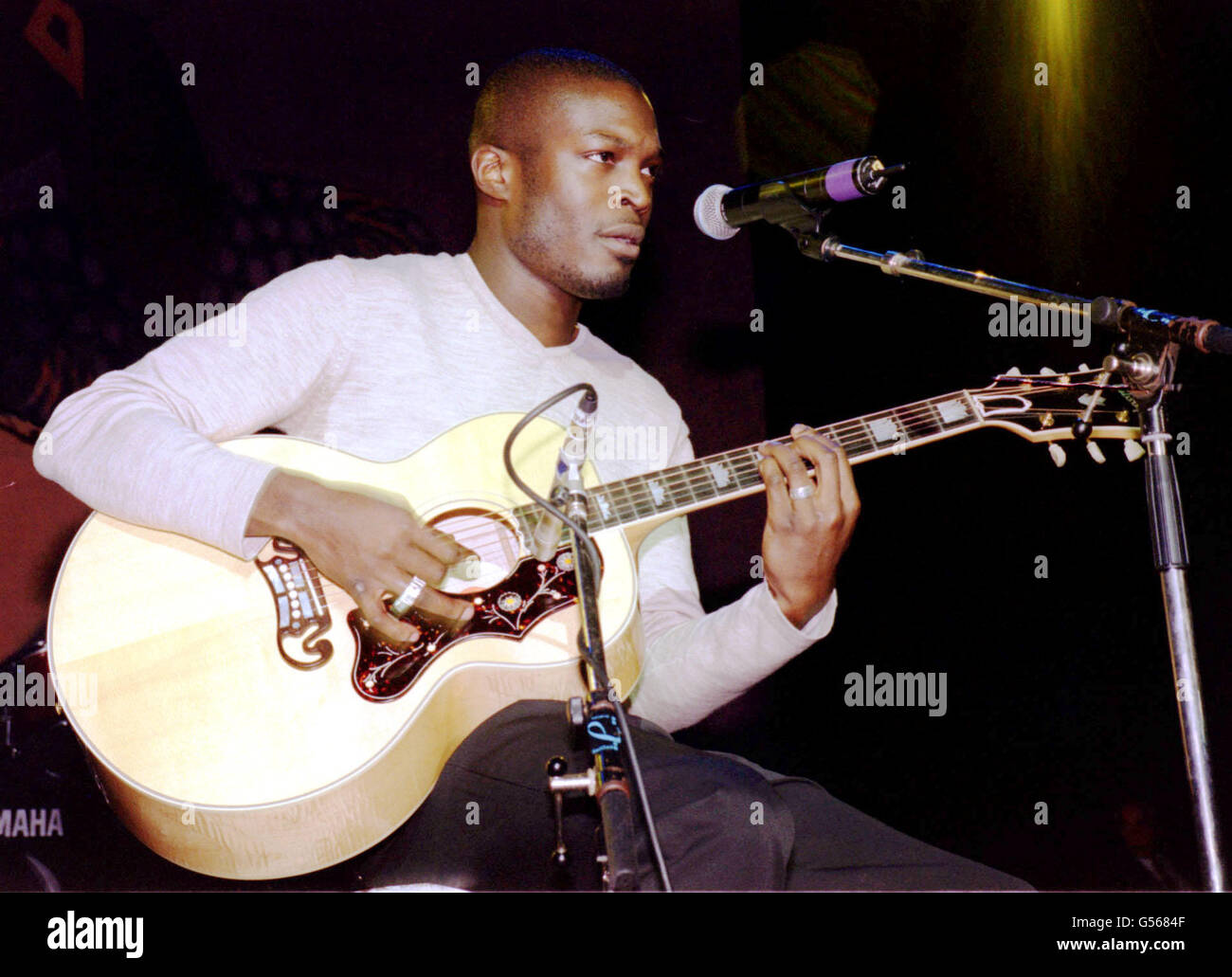 Singer-songwriter Lyndon David Hall performing on stage at a Memorial ...