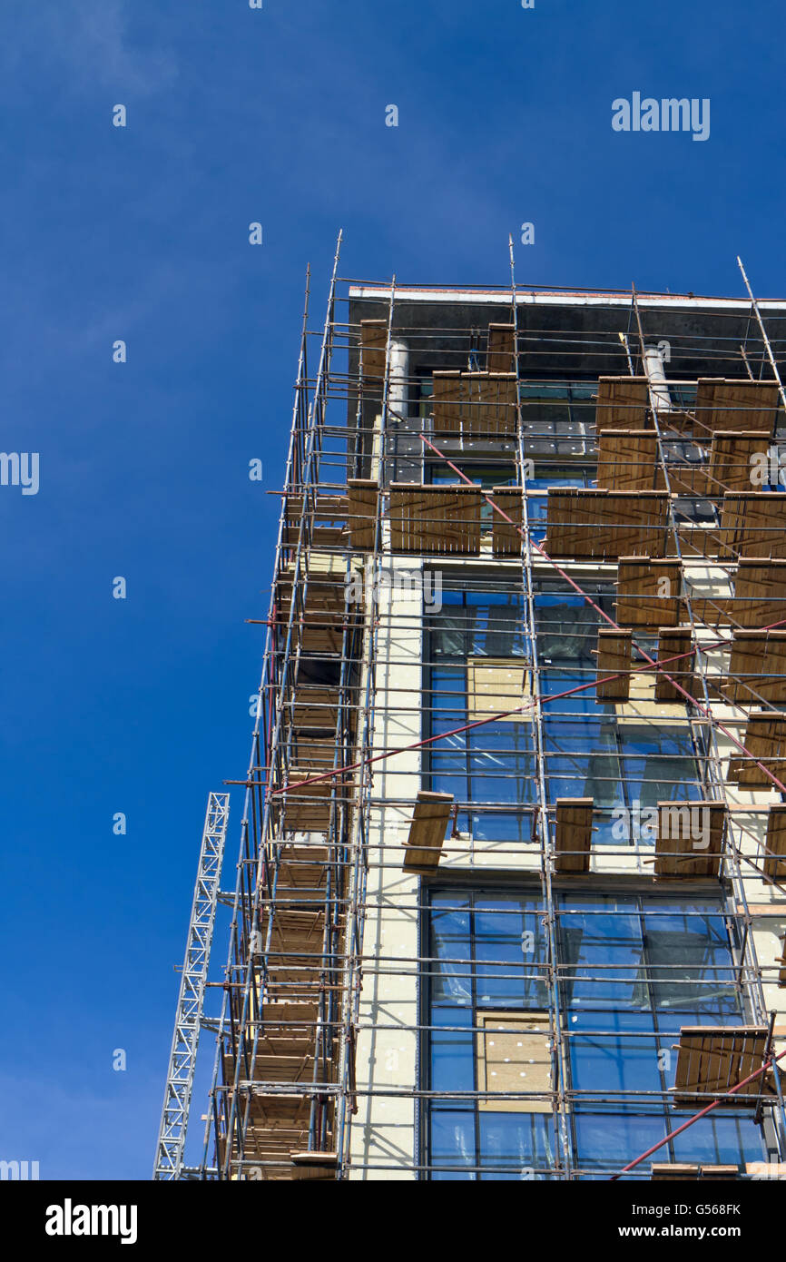 Incomplete modern building under construction with scaffolding Stock ...