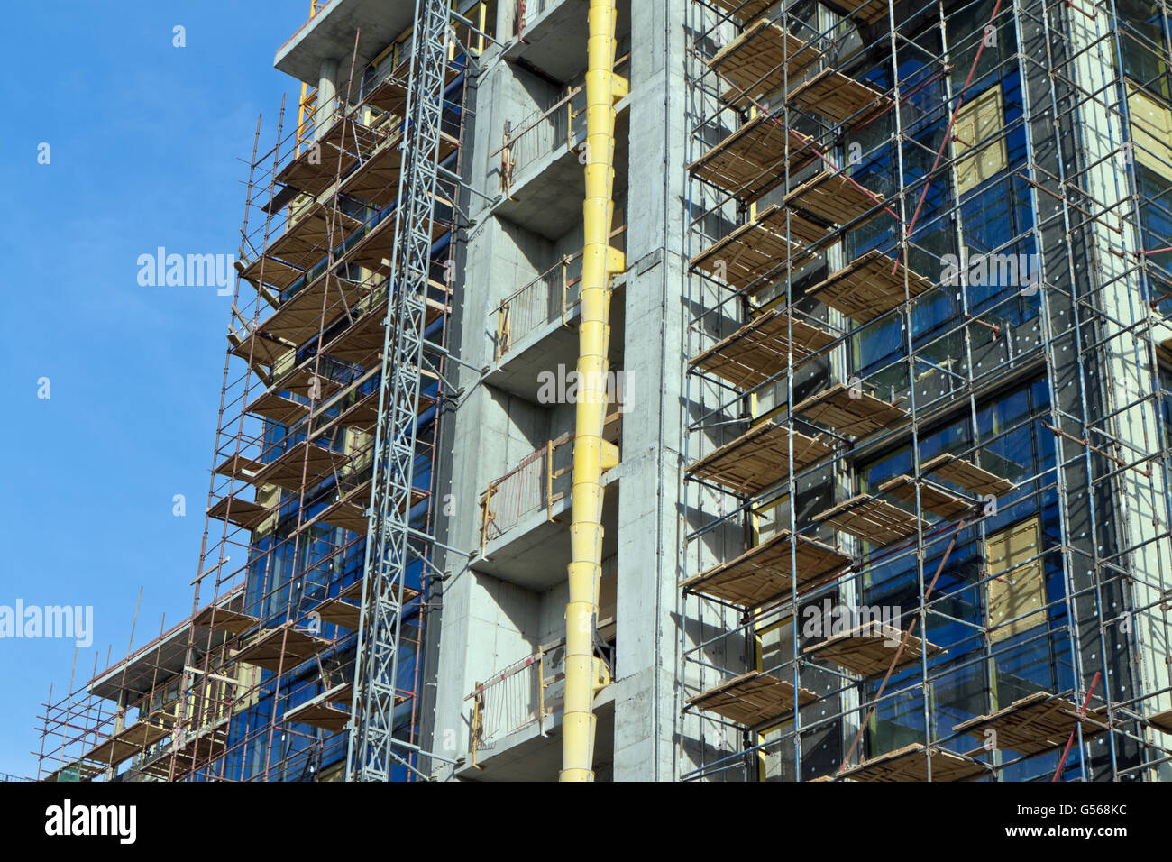 Incomplete modern building under construction with scaffolding Stock ...