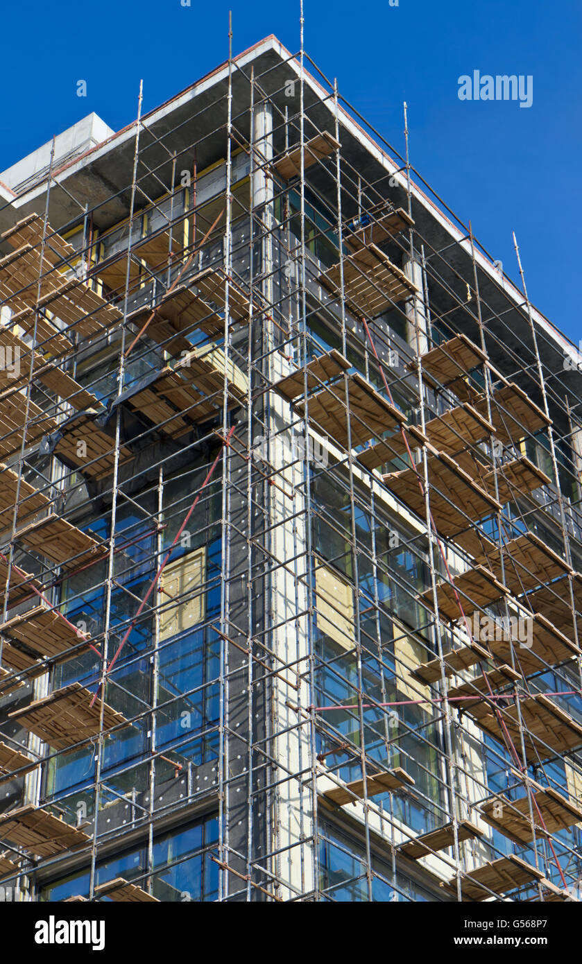Incomplete modern building under construction with scaffolding Stock ...
