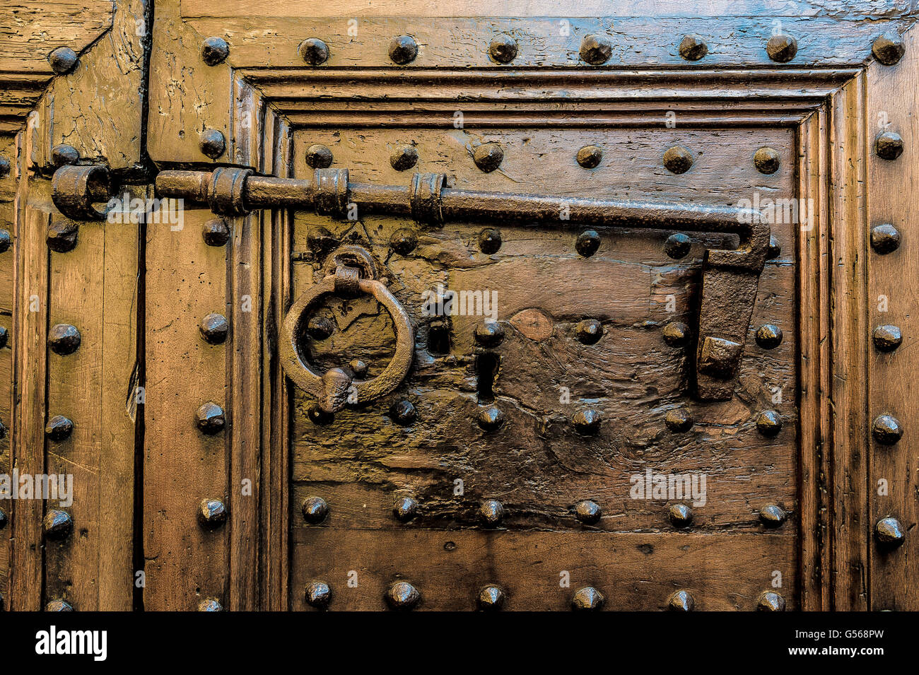 Old stud riveted Door and large sliding metal bolt Florence Stock Photo ...