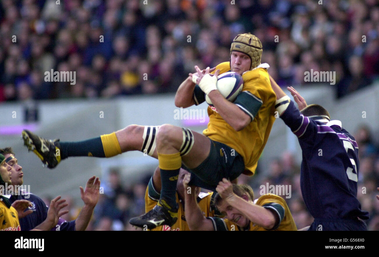 Australia's David Giffin secures the ball past Scotland's Stuart Grimes ...