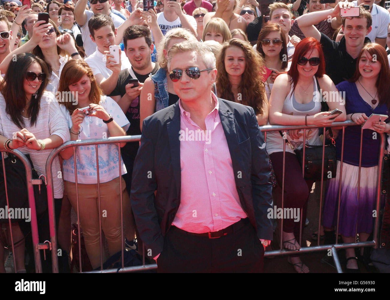 X Factor judge Louis Walsh meets the fans as he arrives at the X Factor ...