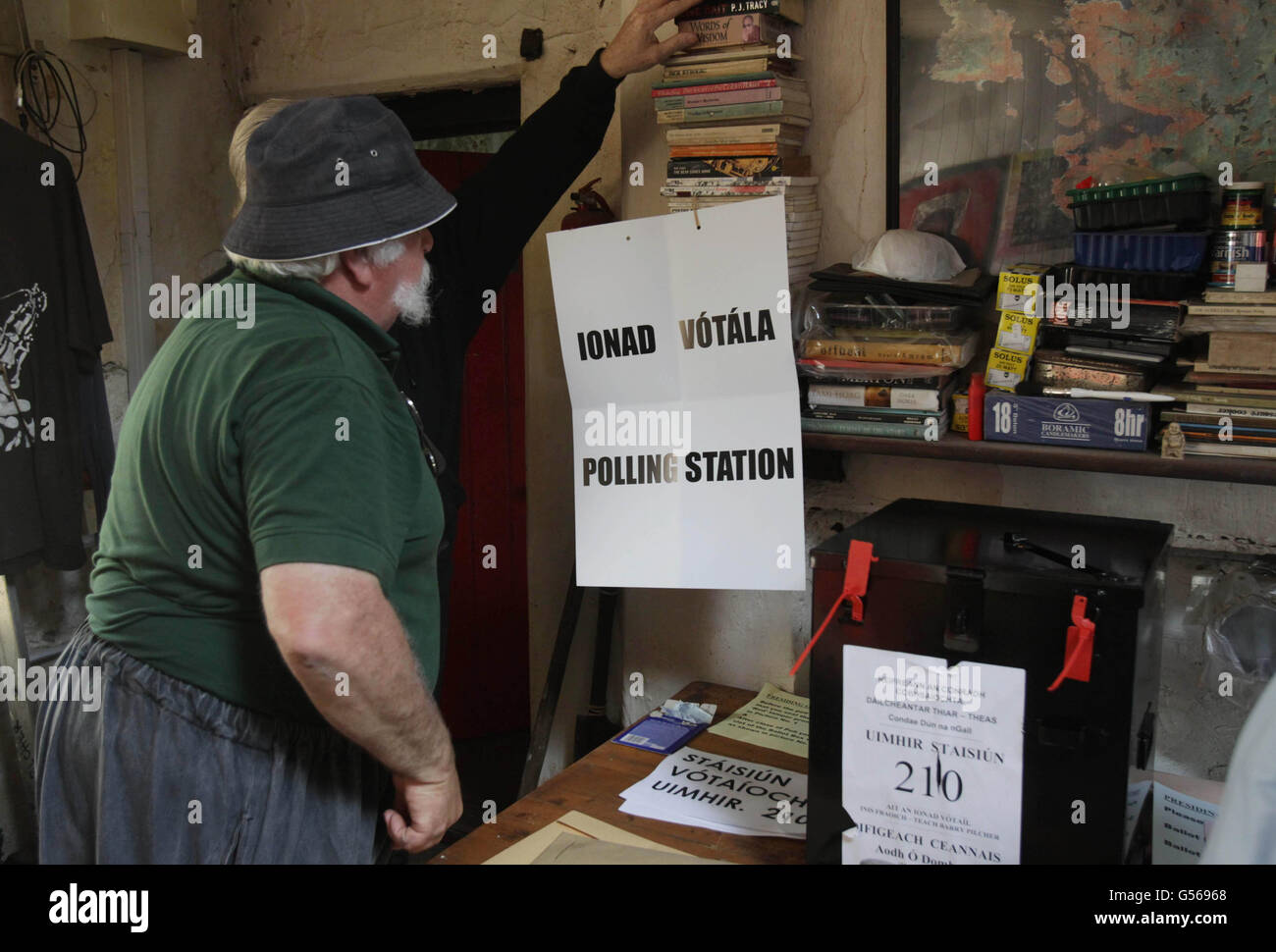 Local man Hans Schleweck stands in the living room of Islander Barry ...