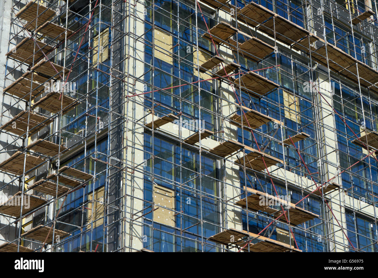 Incomplete modern building under construction with scaffolding Stock ...