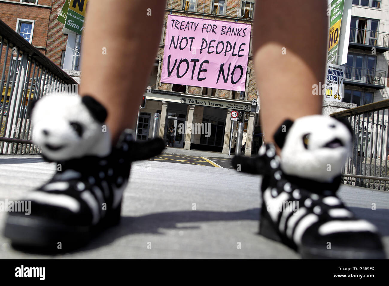 A large banner advocating a no vote hangs from the buildings owned by ...
