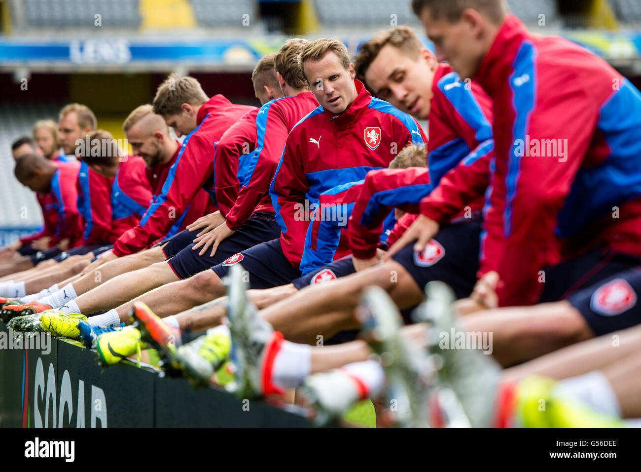 Lens, France. 20th June, 2016. Czech soccer players stretch during a ...