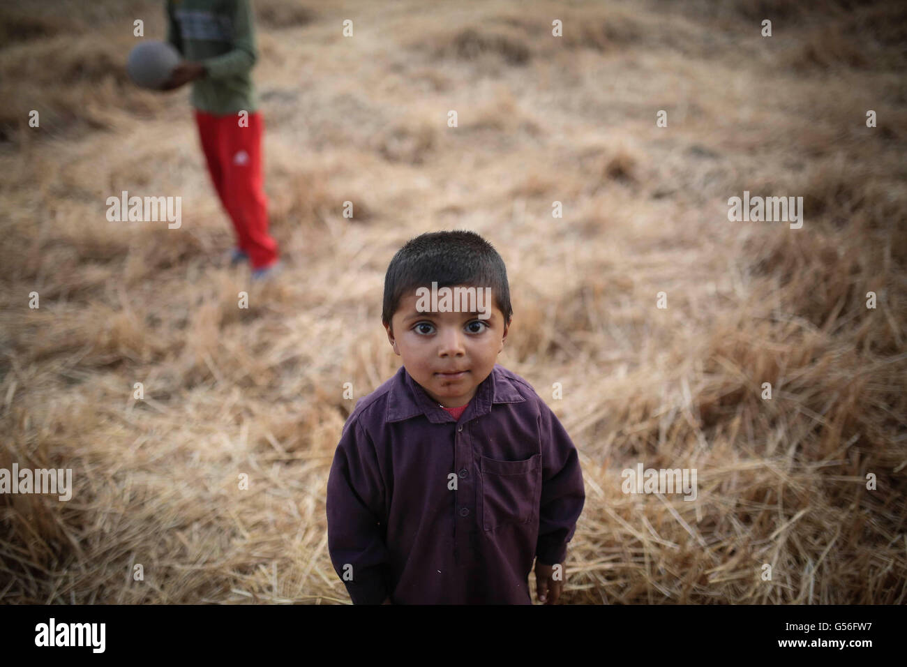 Tehran. 20th June, 2016. A Pakistani refugee boy looks on in a slum on ...