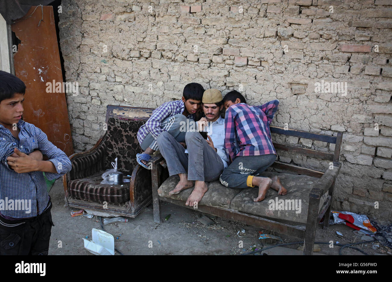 Tehran. 20th June, 2016. Pakistani refugees kill time in a slum on the ...