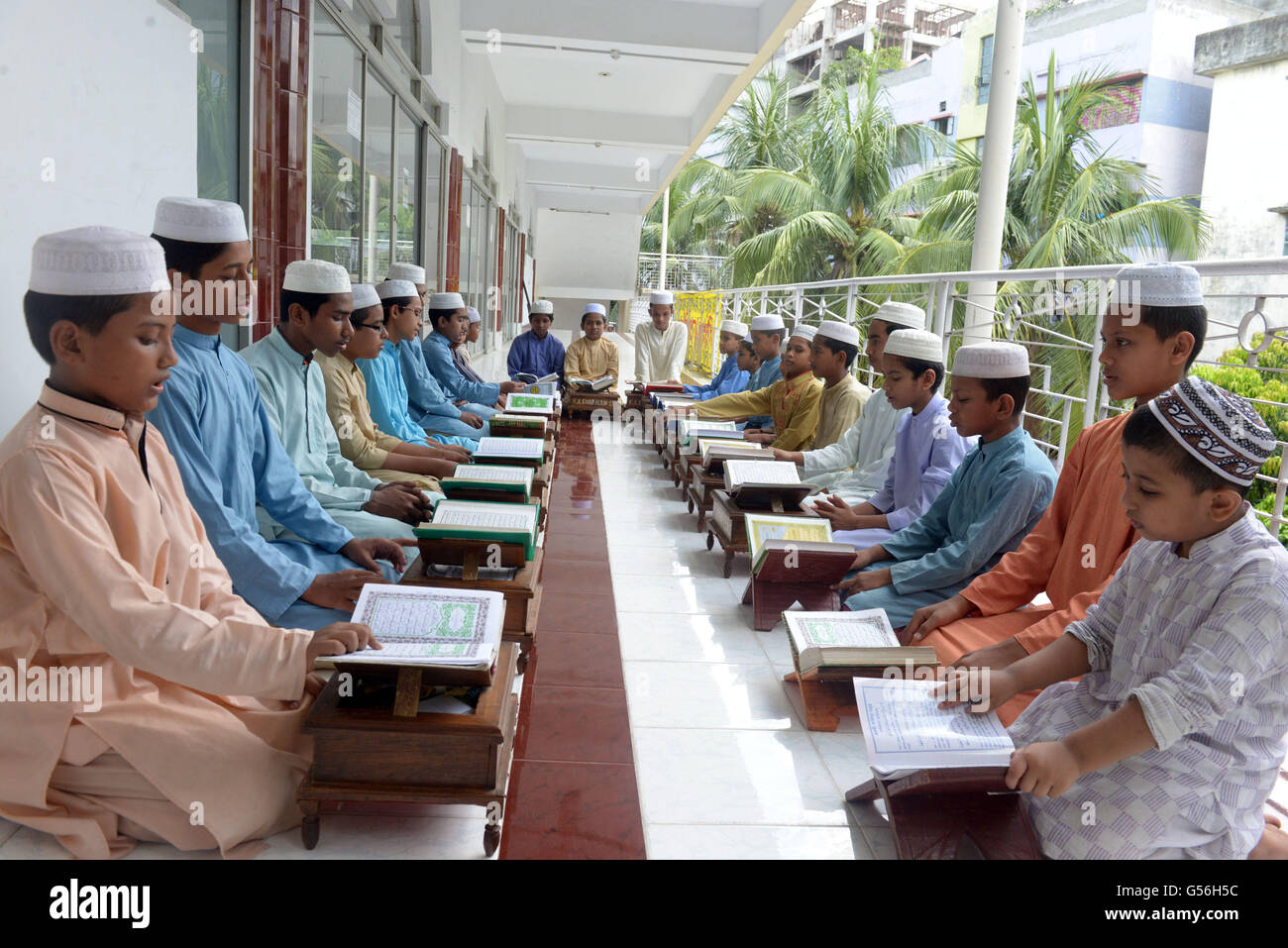 Dhaka, Bangladesh. 20th June, 2016. Bangladeshi Muslims read Quran at a ...