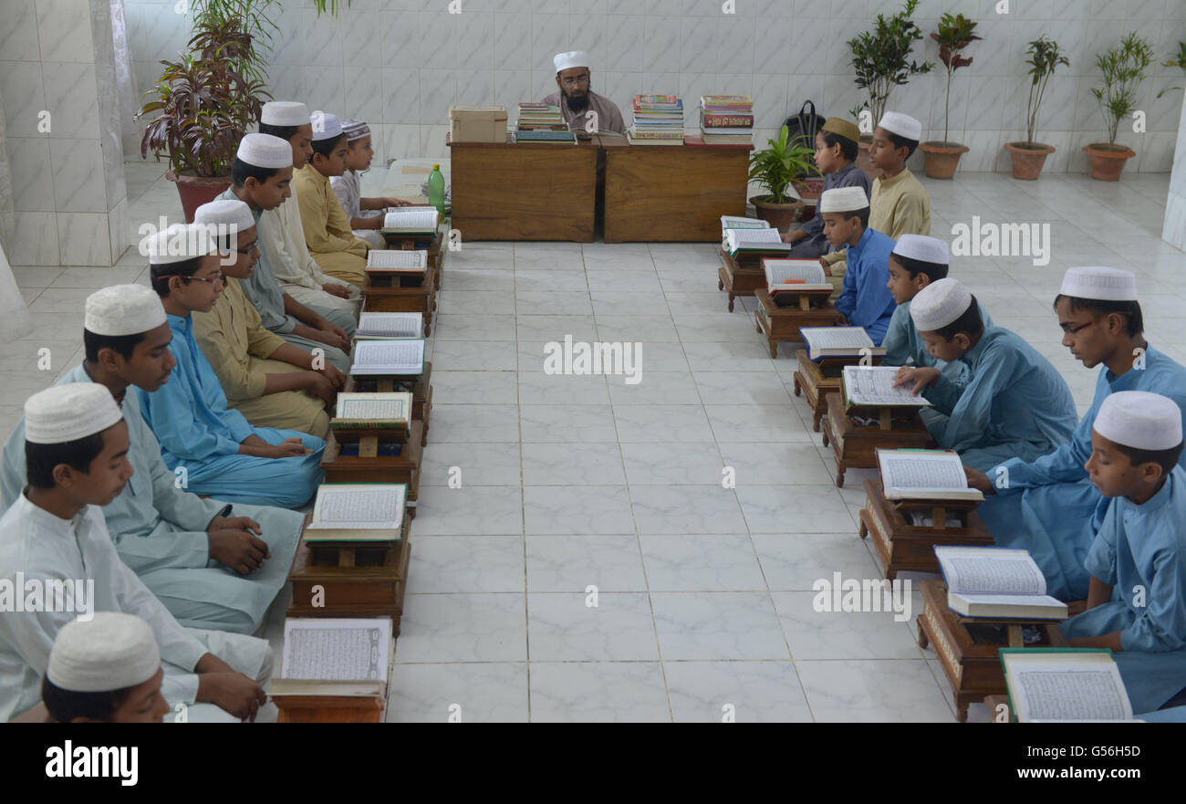Dhaka, Bangladesh. 20th June, 2016. Bangladeshi Muslims read Quran at a ...
