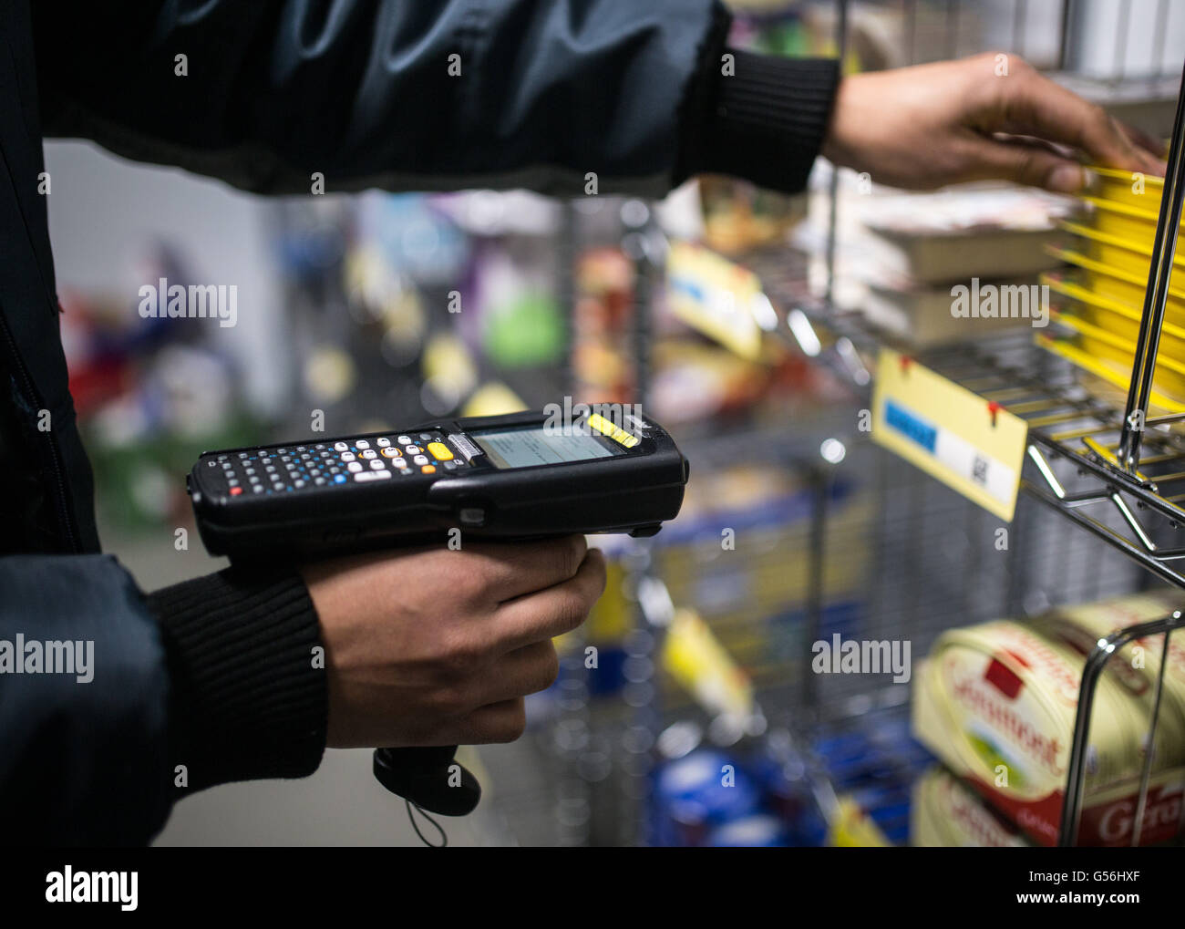 An Amazon Prime Now employee scans the goods to be shipped to a ...