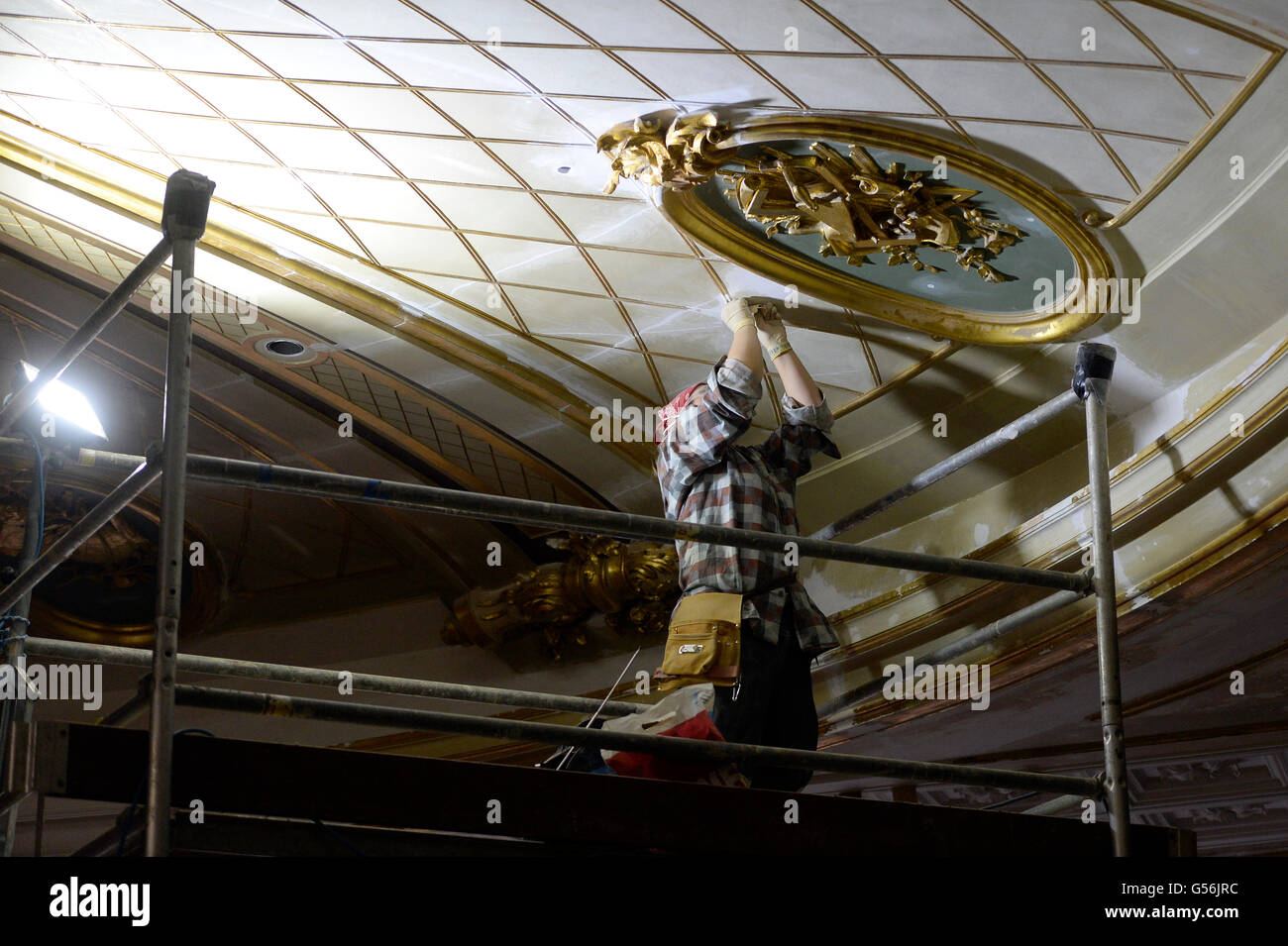 Berlin, Germany. 21st June, 2016. A conservator works on the ceiling of ...