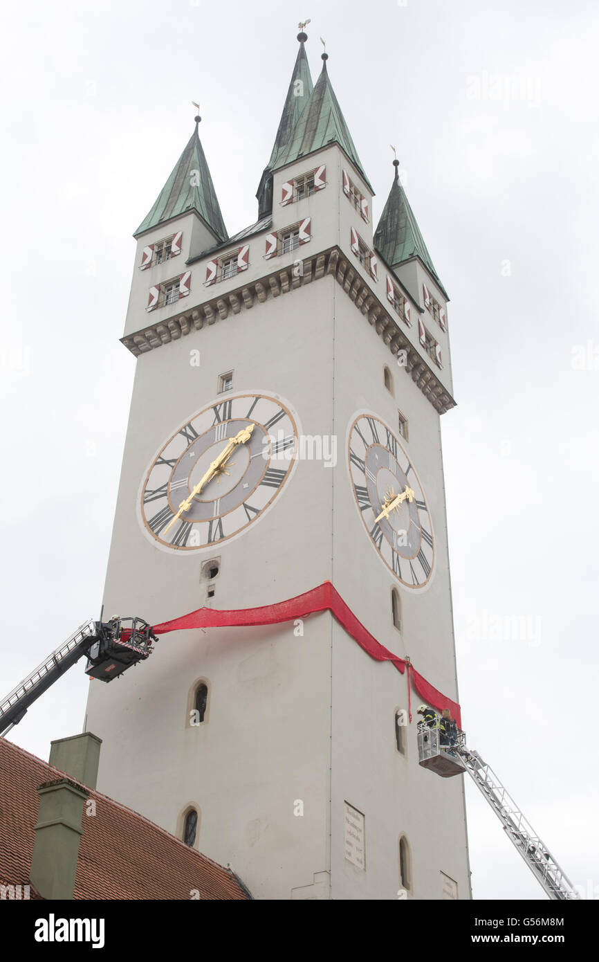 Straubing, Germany. 21st June, 2016. A giant ribbon being attached to ...