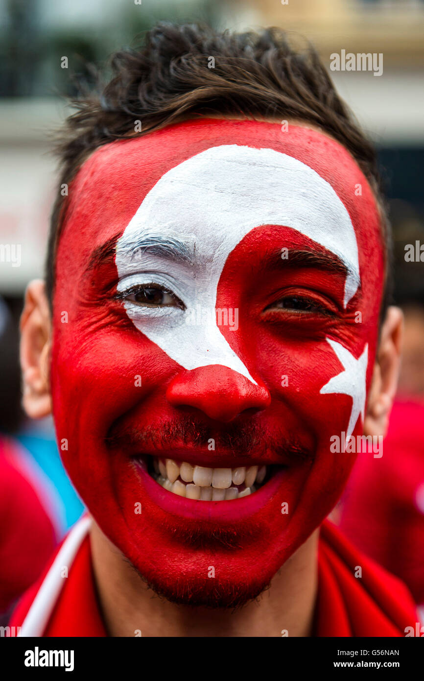Lens, France. 21st June, 2016. Turkish fan poses for photographer prior ...