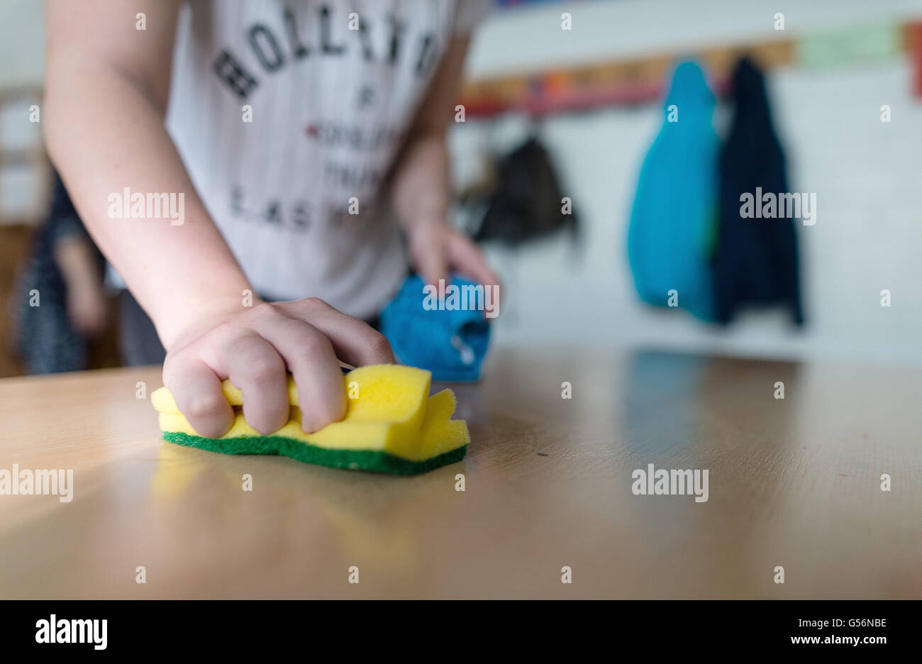 Hanover, Germany. 21st June, 2016. A student cleaning a table during ...