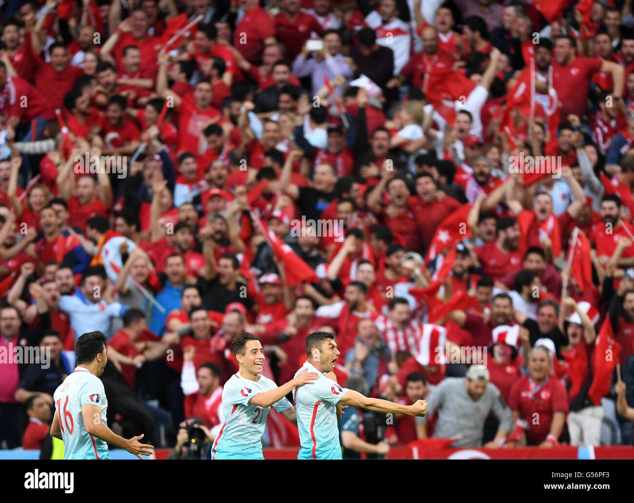 Burak Yilmaz (R) of Turkey celebrates his openig gola with teammatesa ...