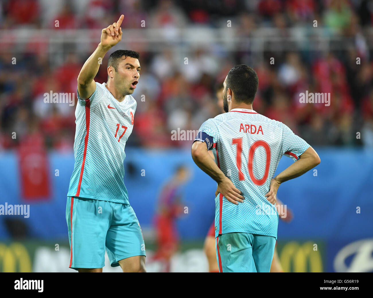 Burak Yilmaz (L) and Arda Turan of Turkey talk during the UEFA Euro ...
