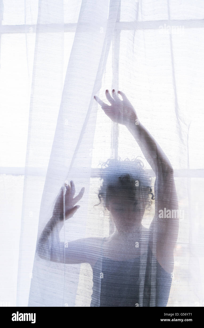 Woman curtain window hi-res stock photography and images - Alamy