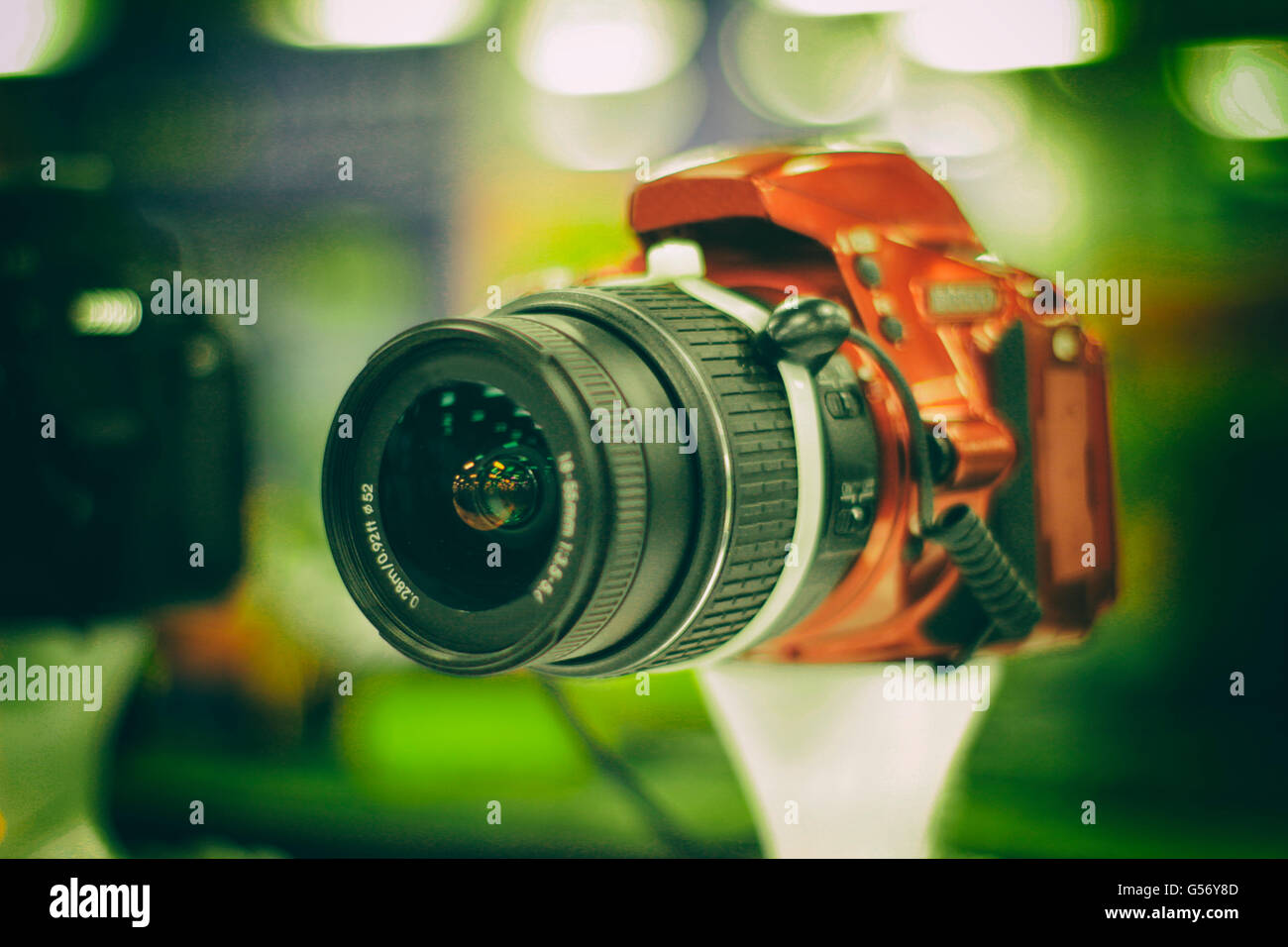Photograph of a red reflex camera on a blurred background Stock Photo ...