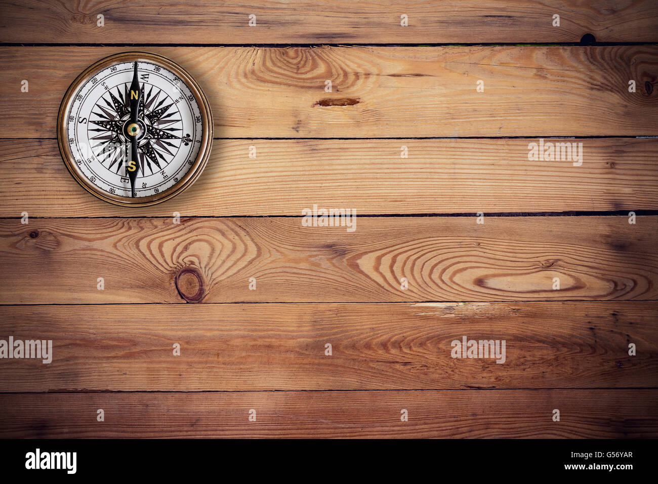 Old vintage compass on ancient hi-res stock photography and images - Alamy