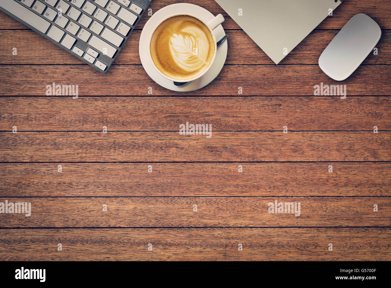 Office table with notepad, computer and coffee cup and computer mouse ...