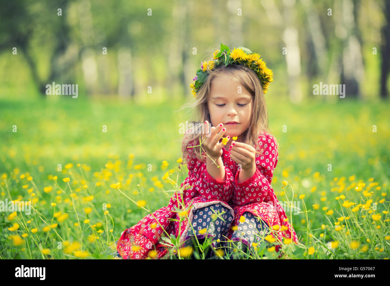 Little girl in spring park Stock Photo - Alamy