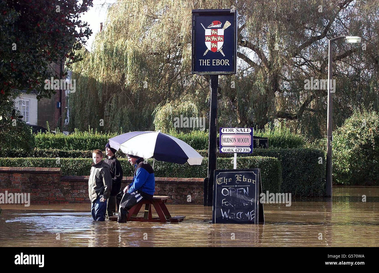 Local residents brave the floods in York, where the River Ouse was two ...