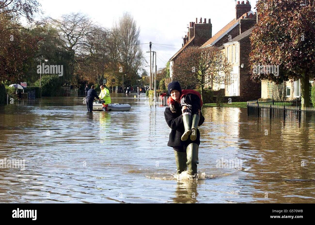 Local residents brave the floods in York, where the River Ouse was two ...