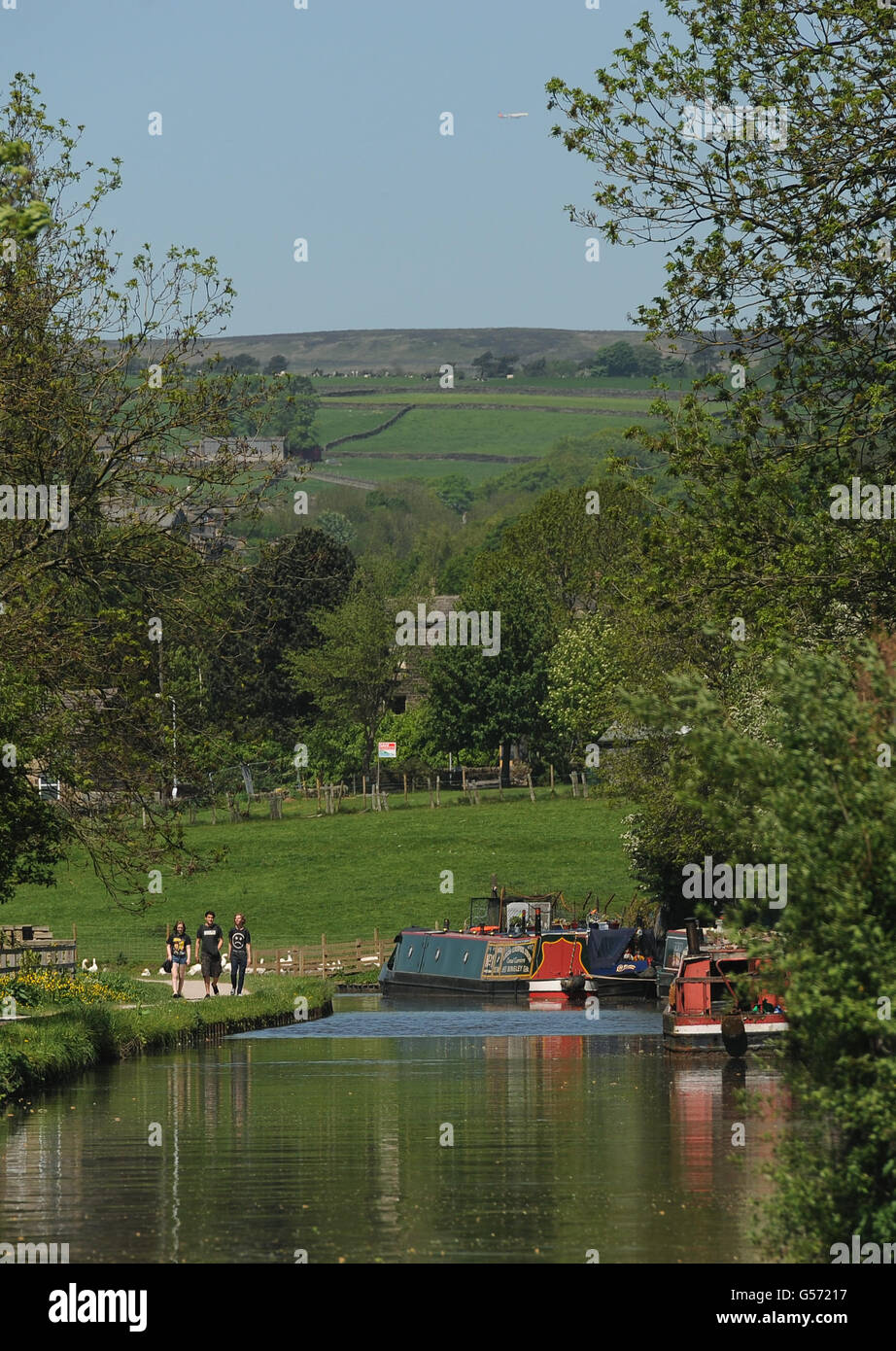 A boat makes its way along the Leeds and Liverpool Canal at Five Rise ...