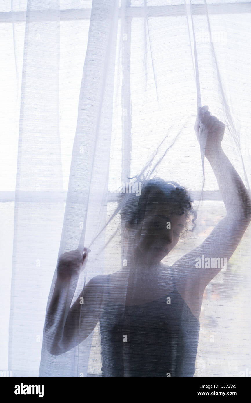 Woman by the window Stock Photo - Alamy