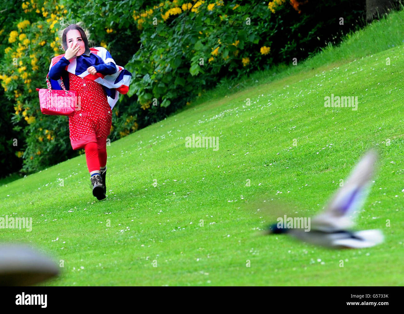 Phoebe Mitchell, aged six from Buxton, wearing a Union flag and a mask ...
