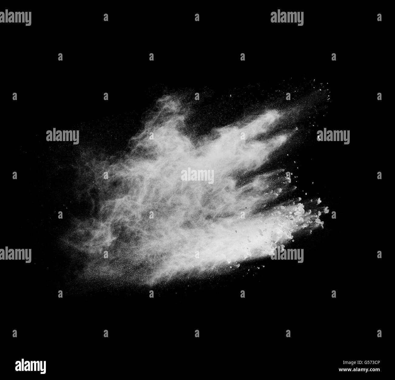 White powder explosion isolated on black background Stock Photo - Alamy