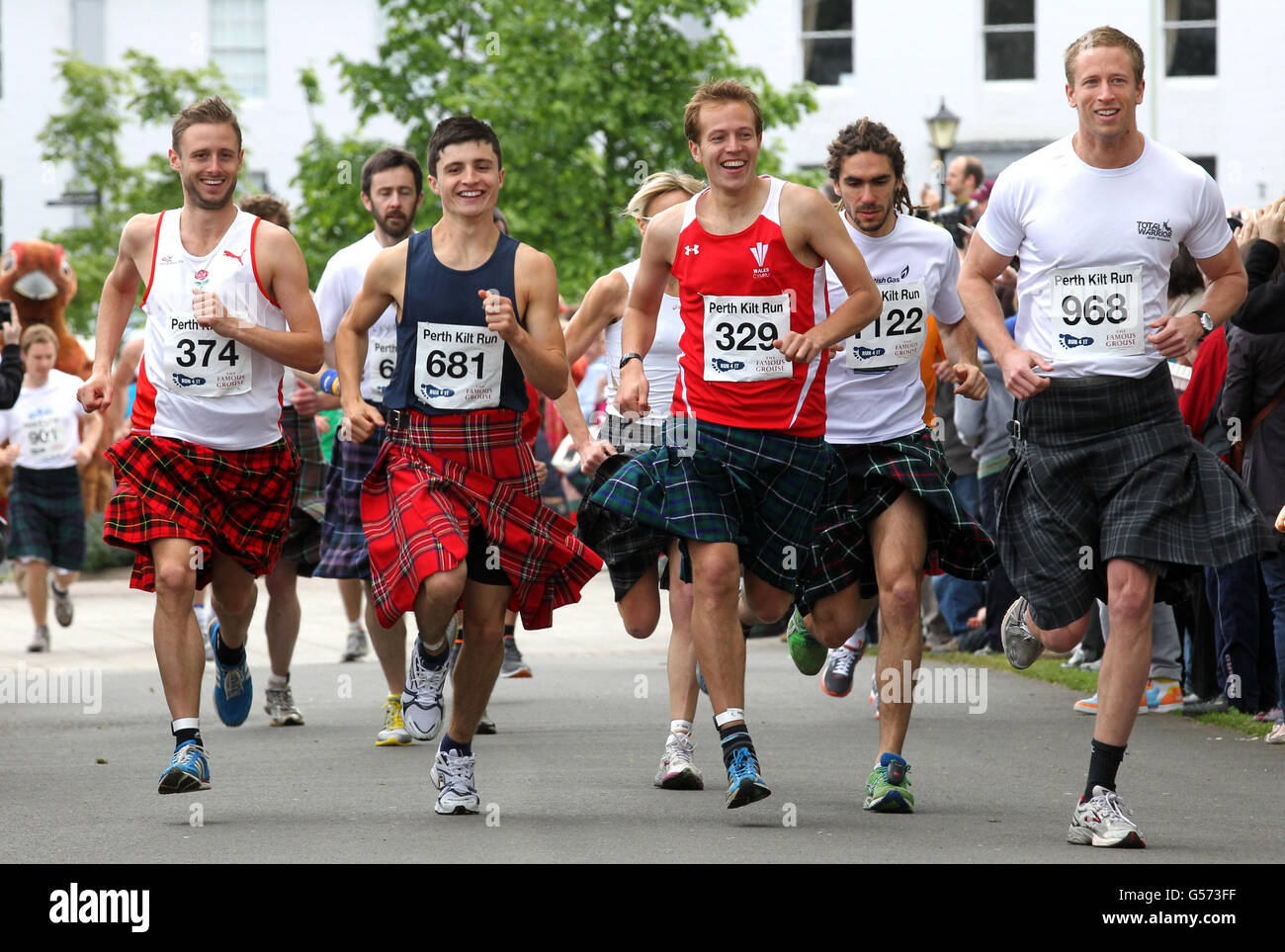 Competitors take part in the Kilt Run in the North Inches area of Perth ...
