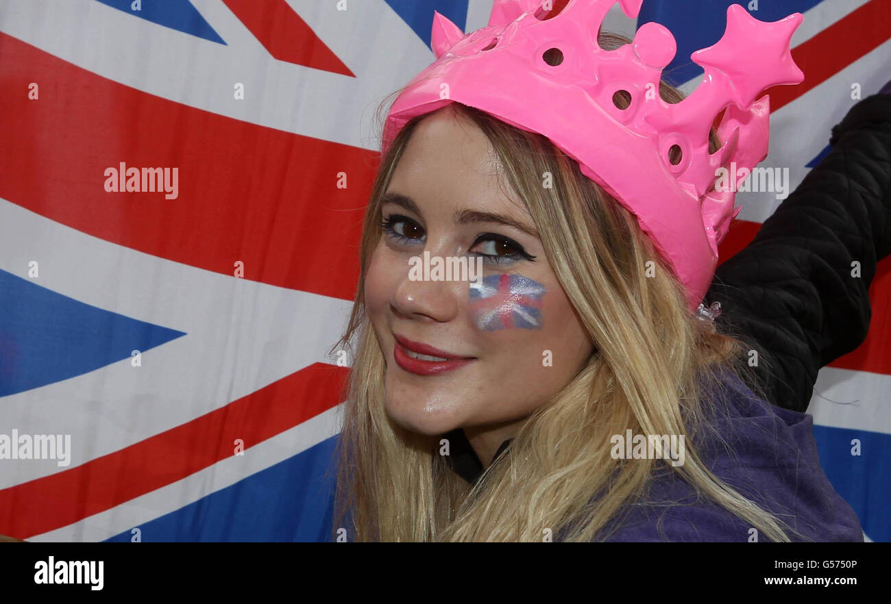 Royal reveller, Anne Higgins, 22, a teacher from Wimbledon, waits in ...