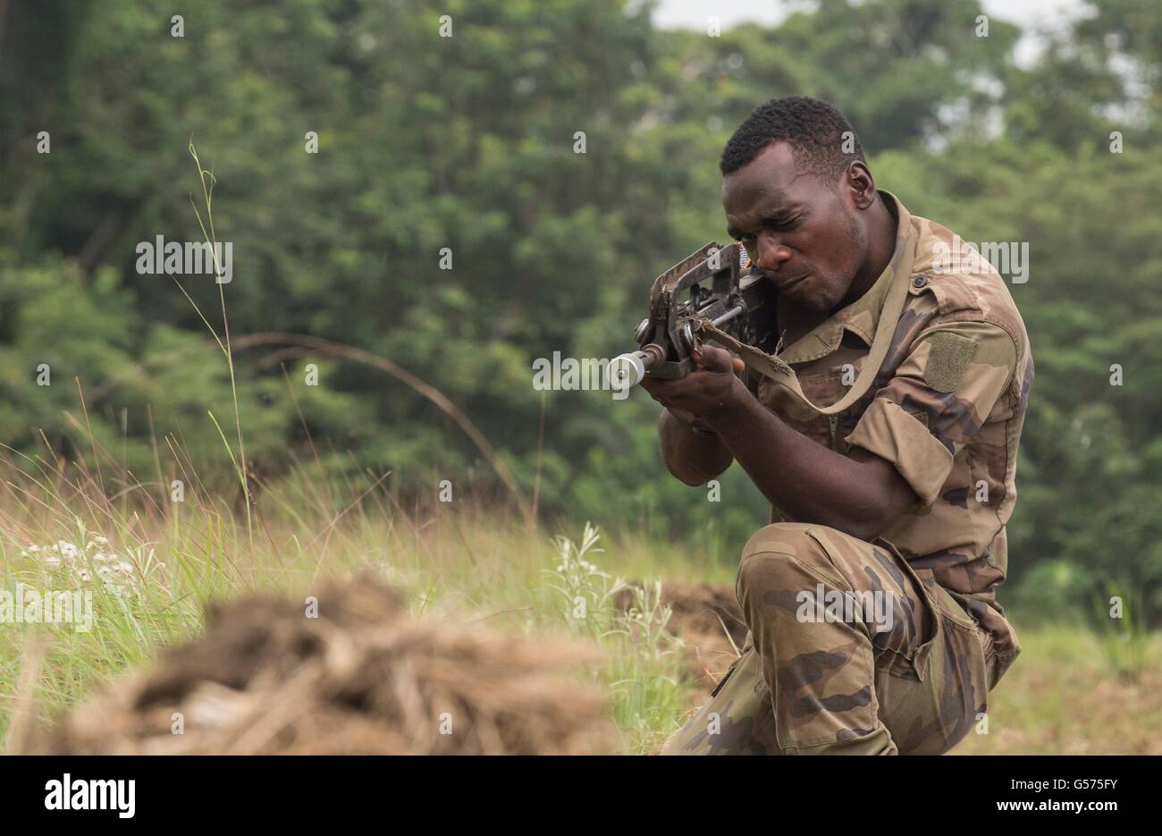 A Gabonese Armed Forces soldier during a simulated combat exercise at ...
