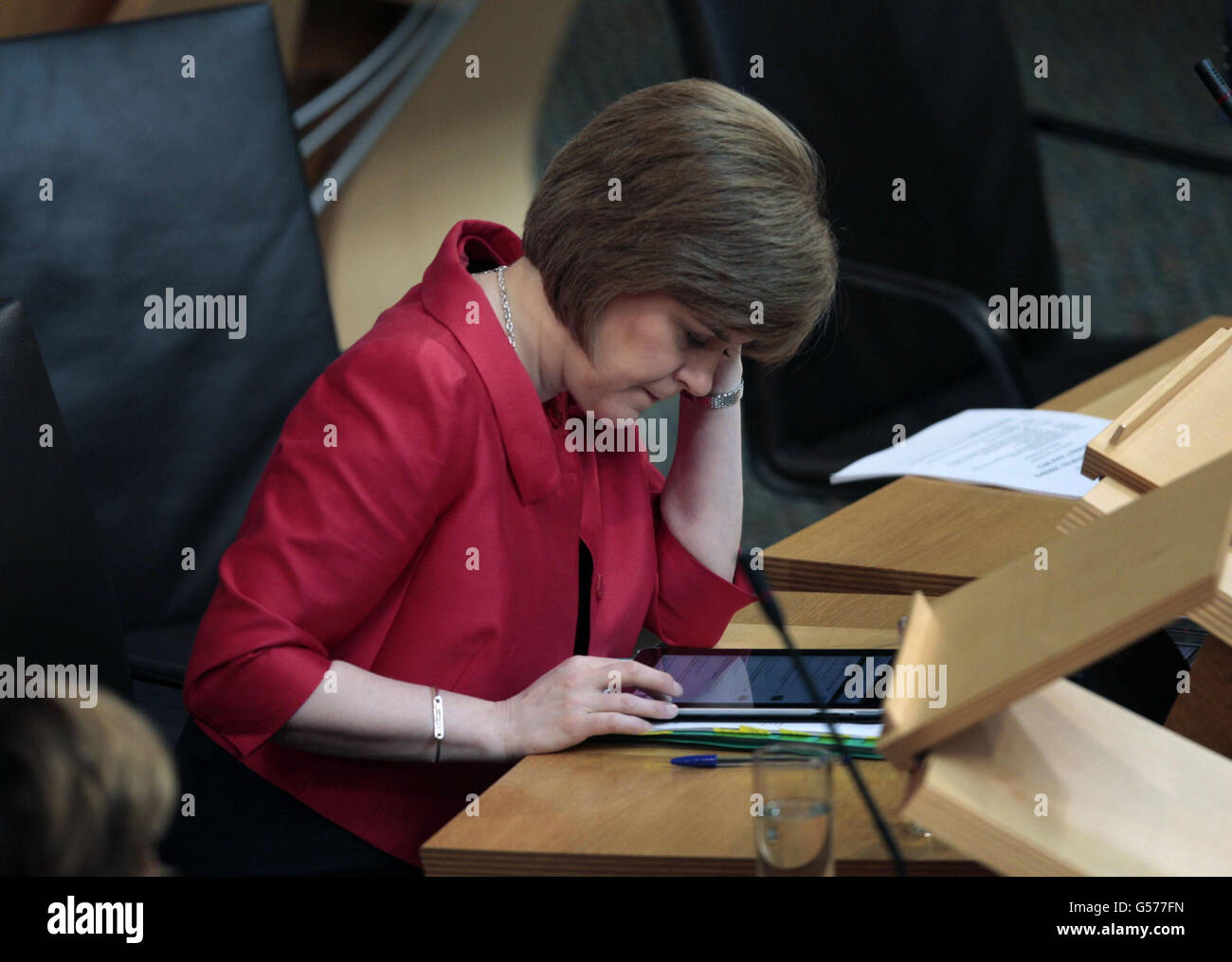 Scottish Health Secretary Nicola Sturgeon uses an iPad at her desk ...
